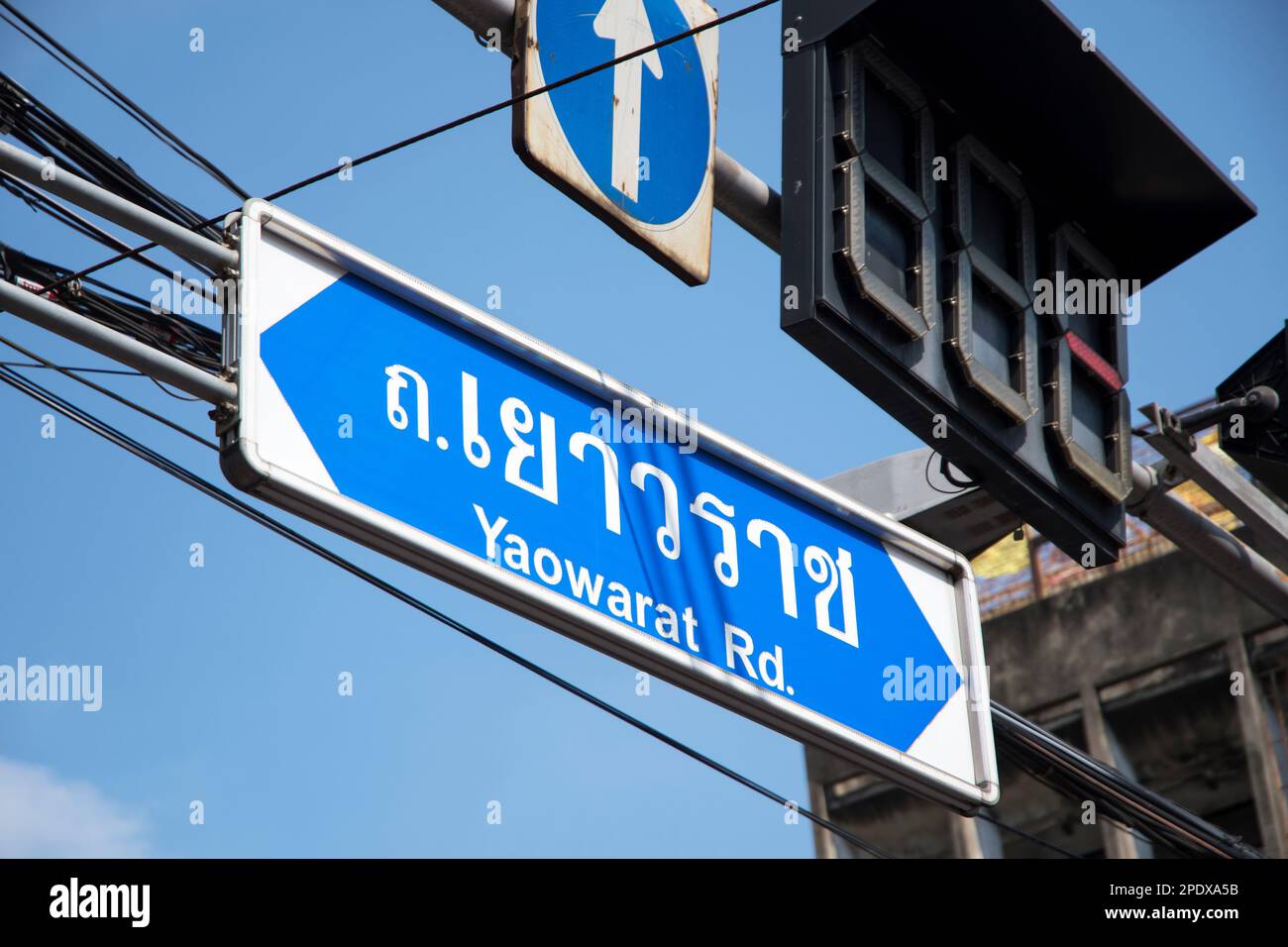 Yaowarat road sign with blue sky. Yaowarat is Bangkok Chinatown of Chinese community and a ...