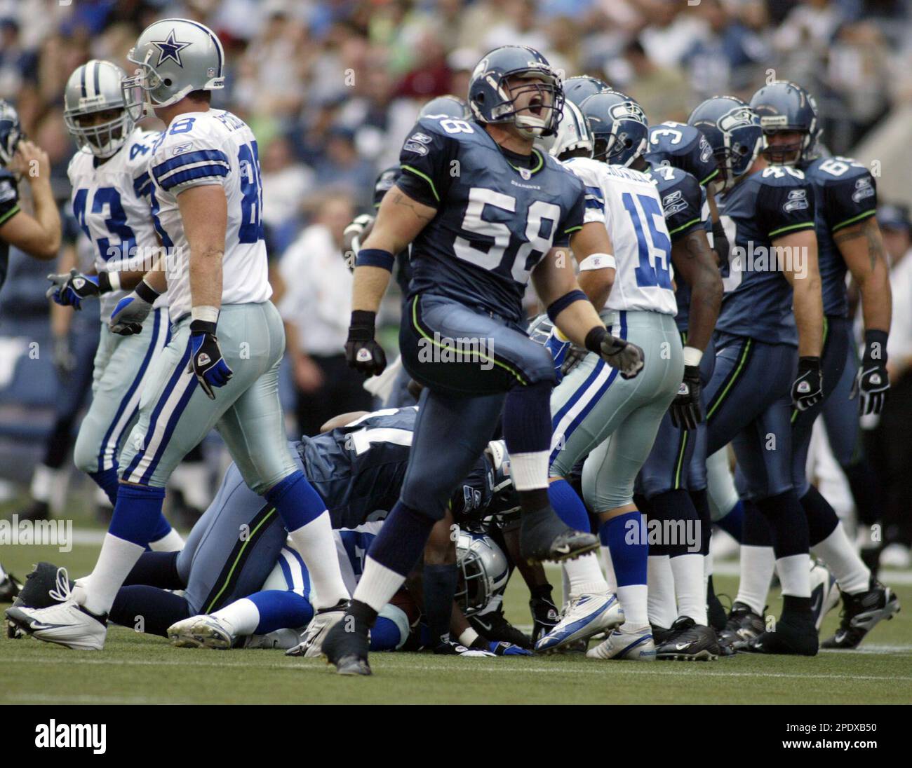 Seattle Seahawks linebacker Isaiah Kacyvenski howls after tackling ...