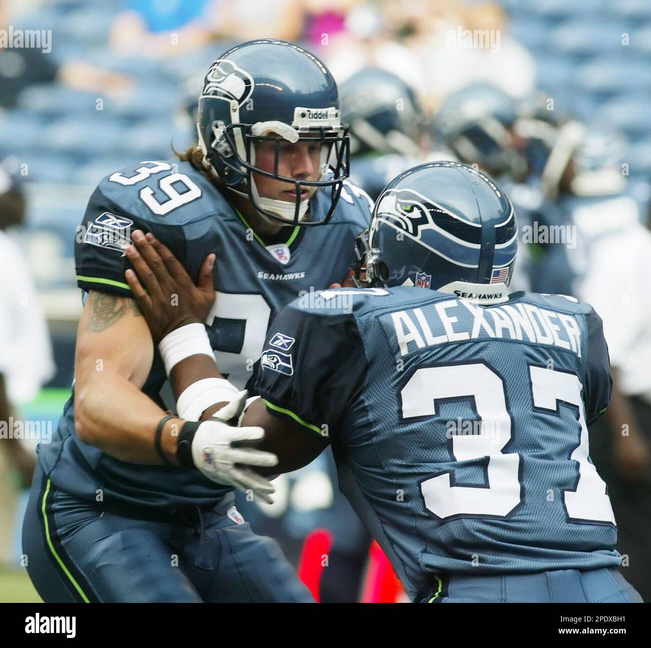 Seattle Seahawks' Jesse Lumsden, left, a rookie from Canada runs ...
