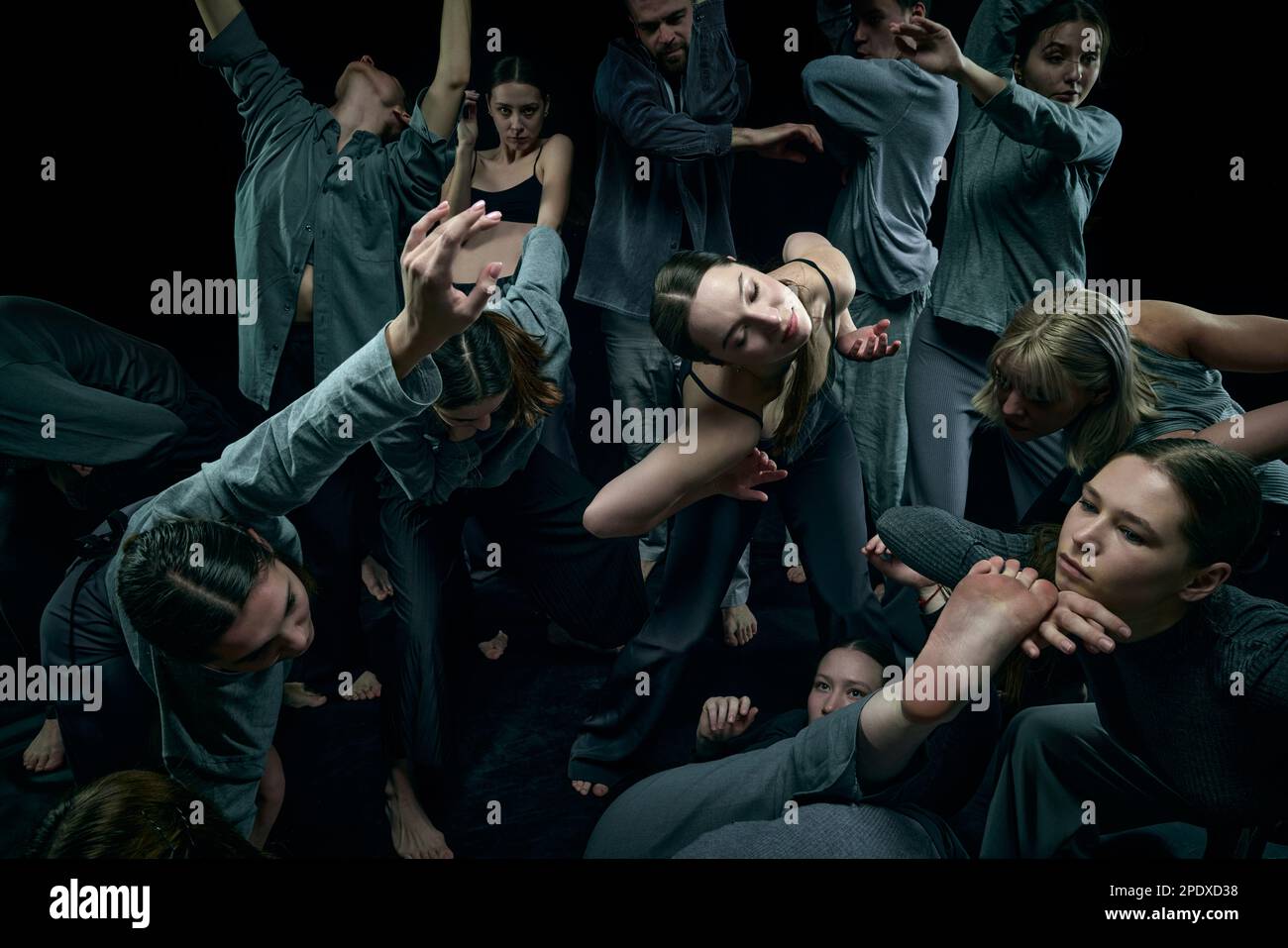 Chaotic movements. Group of different young people dancing against ...