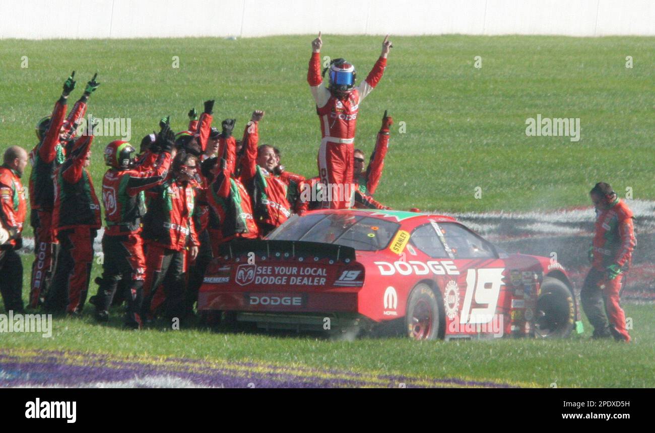 Jeremy Mayfield celebrates his victory in the grassy area in front of ...
