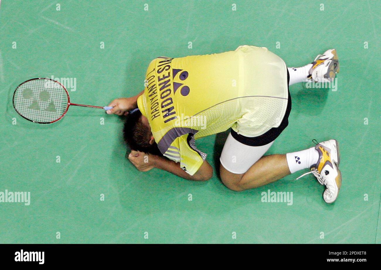 Indonesia's Luluk Hadiyanto reacts as he and his teammate Yulianto ...