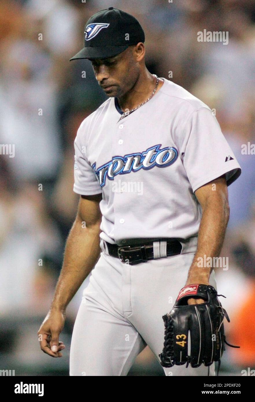 Toronto Blue Jays reliever Miguel Batista walks off the field after ...