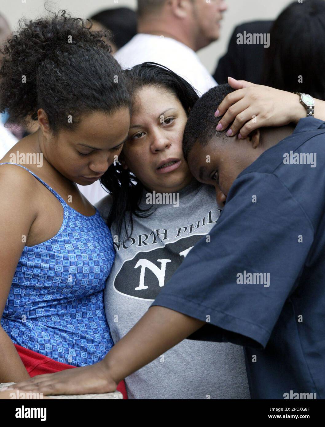 Cousinsof LaToyia Figueroa, 24, from left, Tasha Julius, Michelle Perez ...