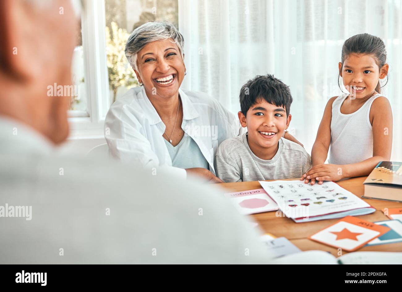 Grandchildren teaching grandma learning hi-res stock photography and ...