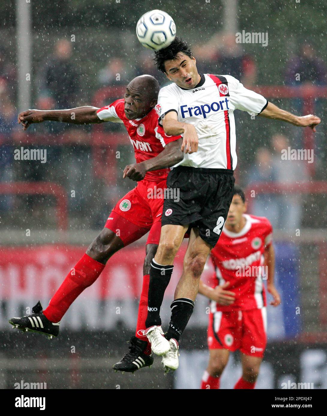 Oberhausen's Cyrille Bella, left, fights for the ball with Frankfurt's ...