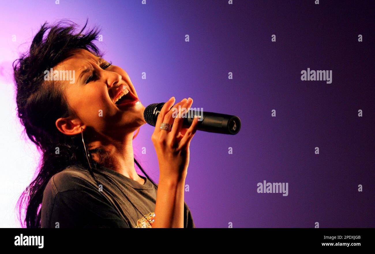 Hong Kong singer Coco Lee performs during a mini concert as celebrating ...