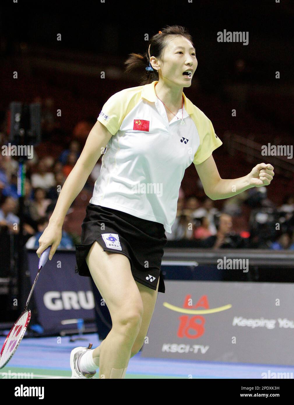 China's Zhang Ning reacts as she defeats Hong Kong's Yip Pui Yin during ...