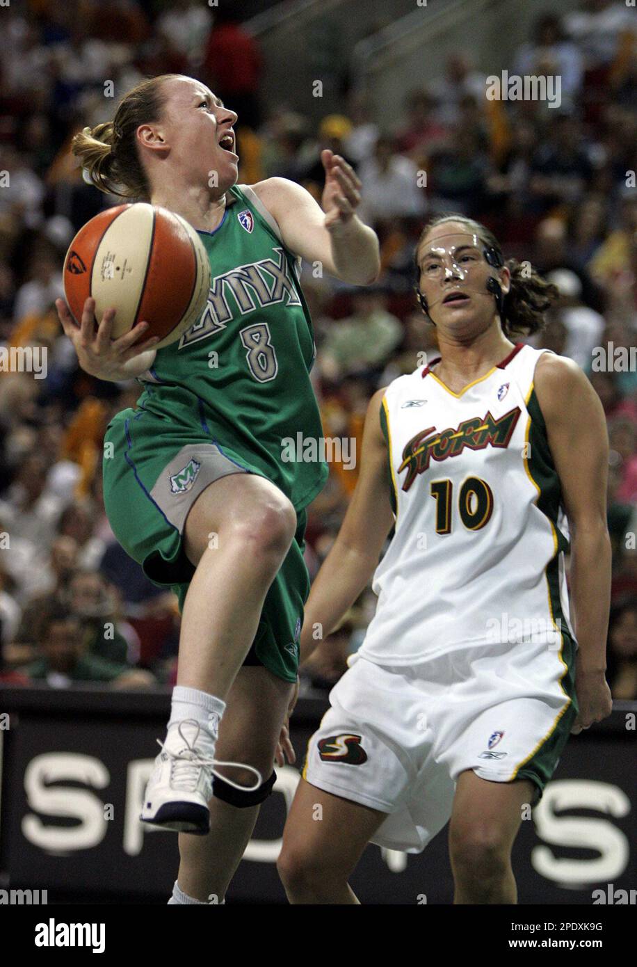 Minnesota Lynx' Kristi Harrower (8) drives past Seattle Storm's Sue ...