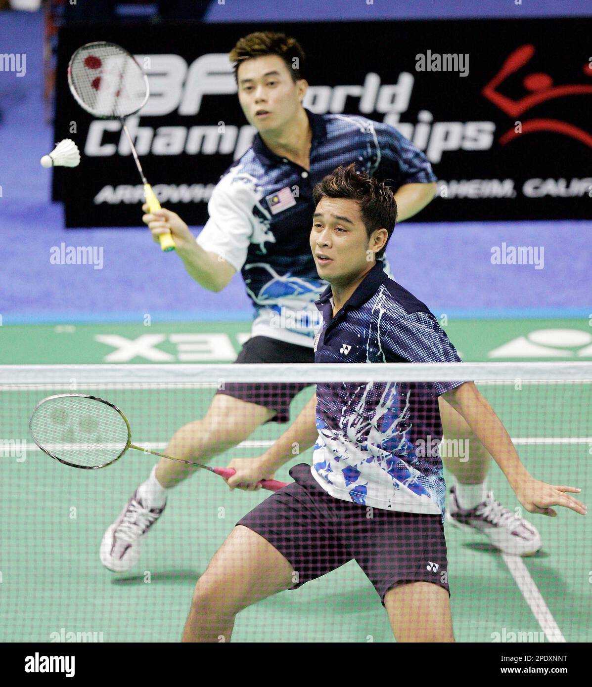 Malaysia's Woon Fui Lin, top, returns a shot to Thailand's Sudket ...