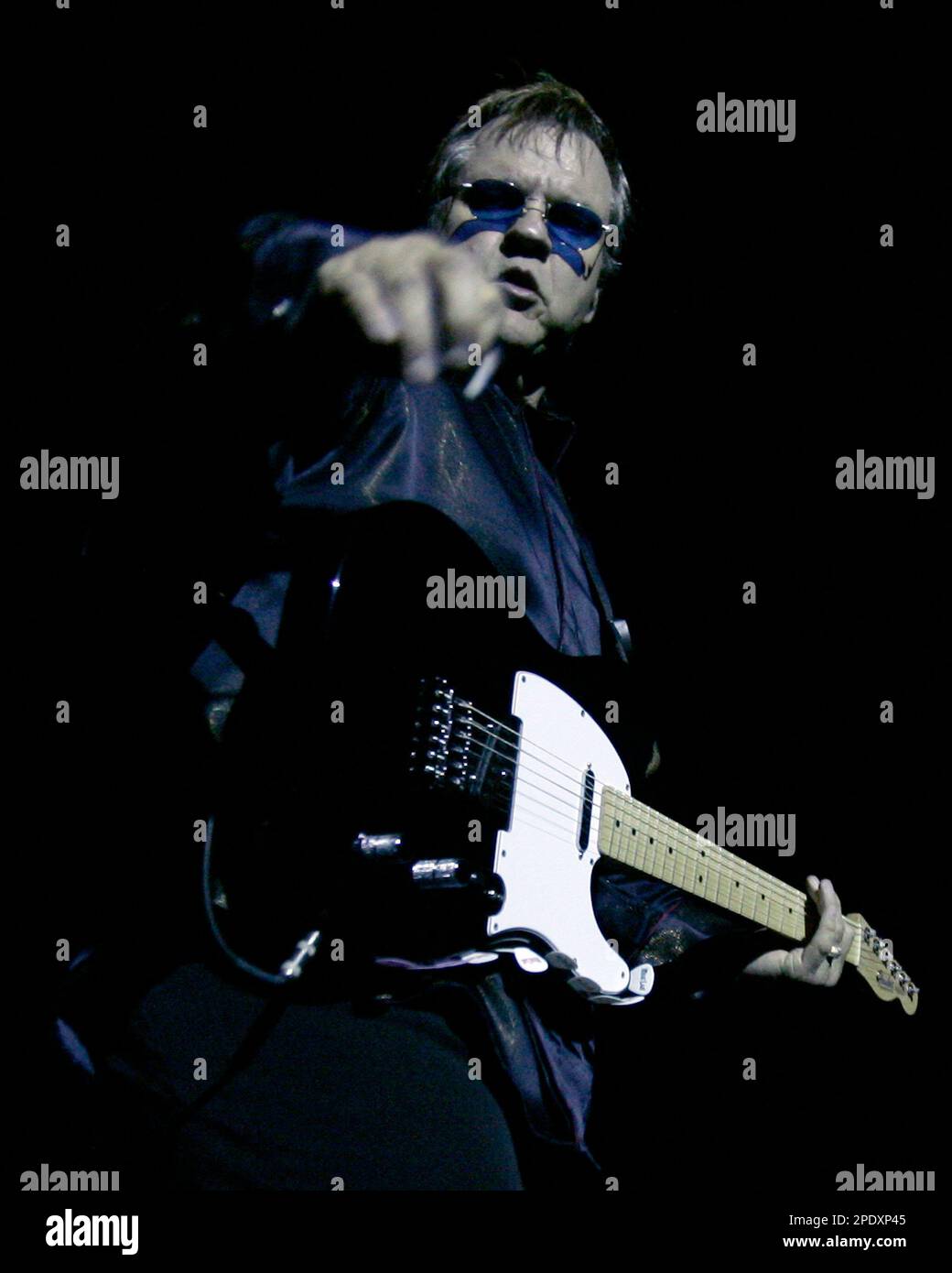 Rock singer and musician Meat Loaf performs with his band and back-up ...