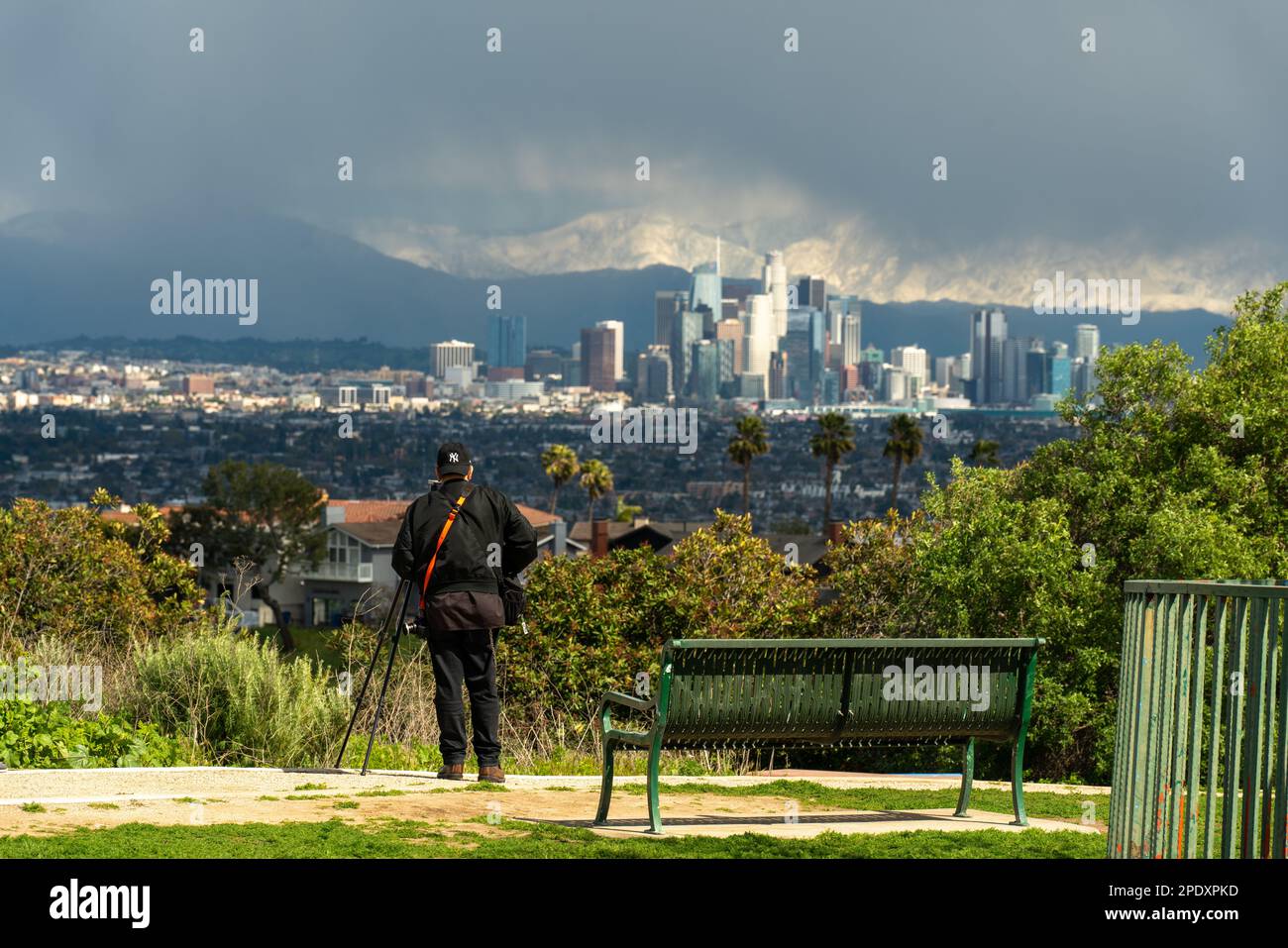 A group of people looking at Los Angeles cityscape from Kenneth Hahn ...