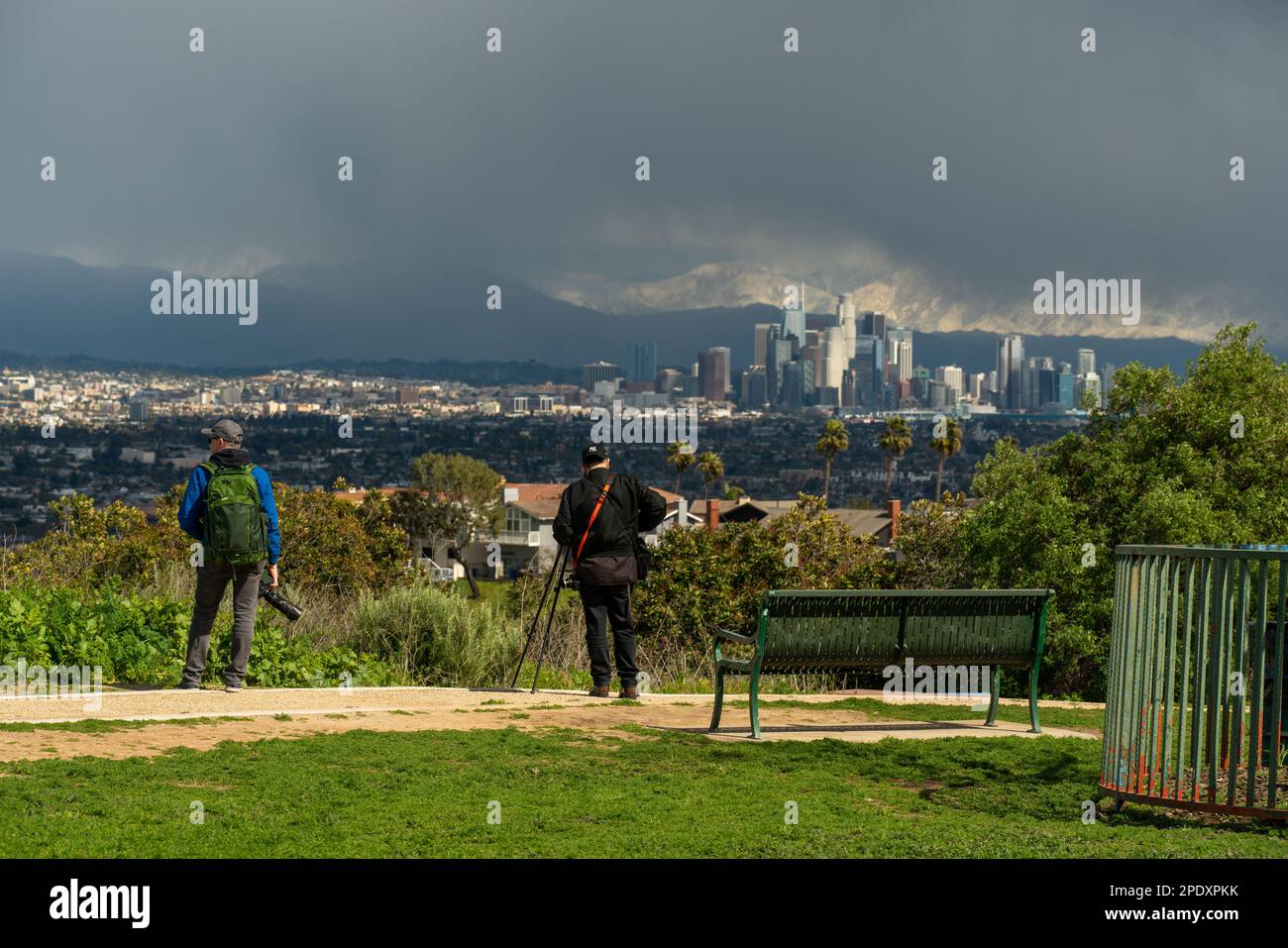 A group of people looking at Los Angeles cityscape from Kenneth Hahn ...