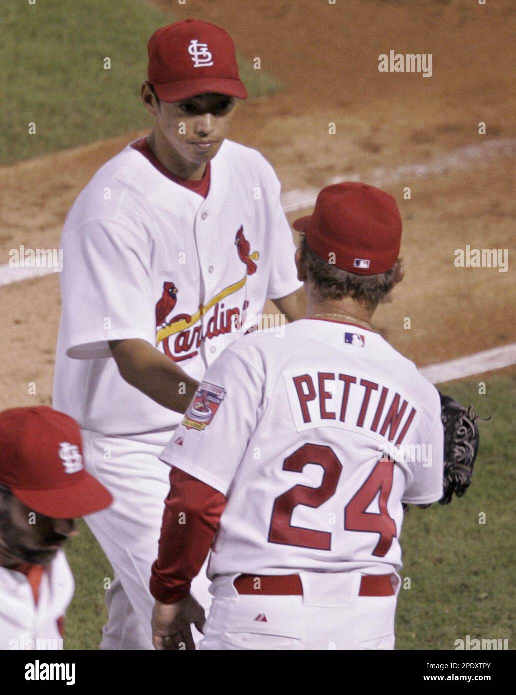 St. Louis Cardinals So Taguchi is congratulated by coach Joe Pettini ...