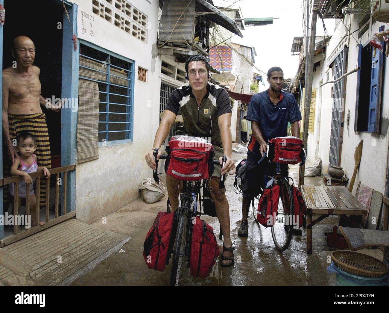Raphael Parker, right, and Jacob Richardson ride their bicycles in ...