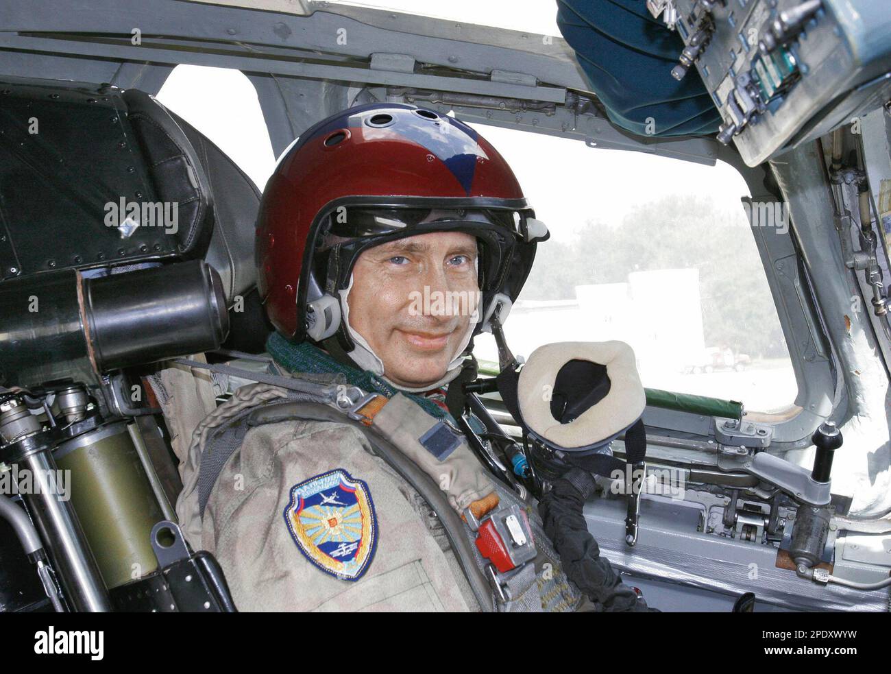 Russian President Vladimir Putin wearing a jump suit sits in the ...