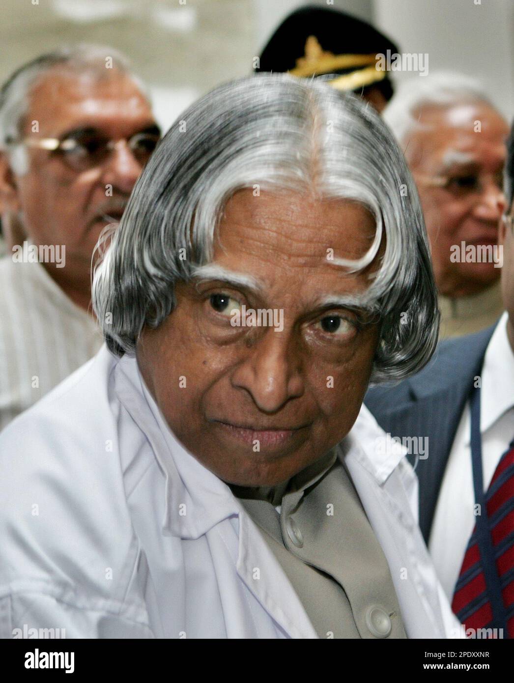 Indian President APJ Abdul Kalam, center, looks on after putting on a ...