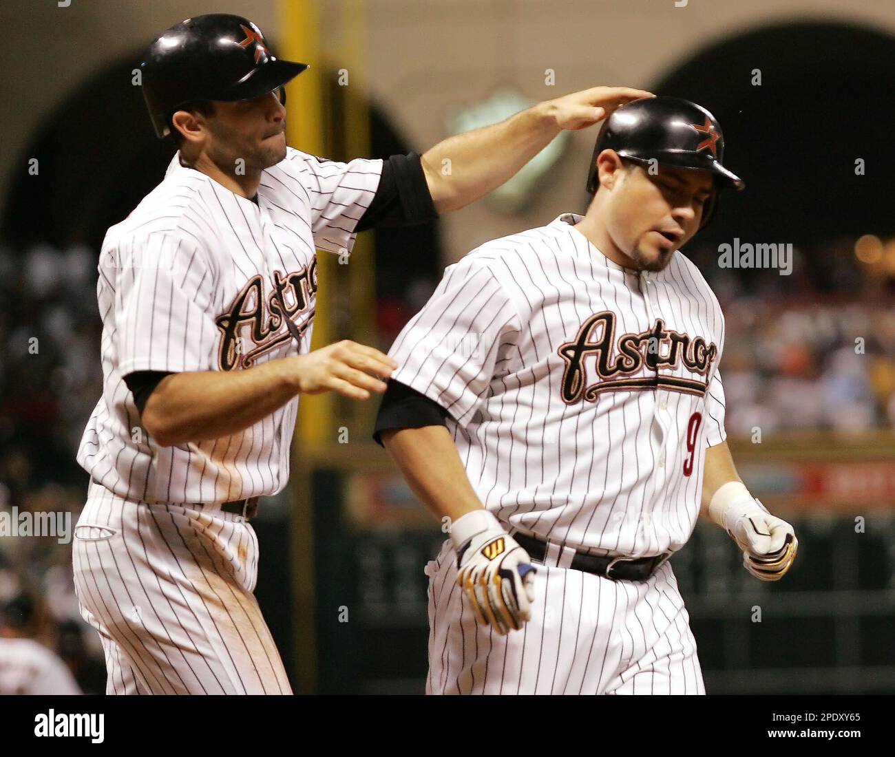 Houston Astros' Humberto Quintero (9) is congratulated by teammate ...