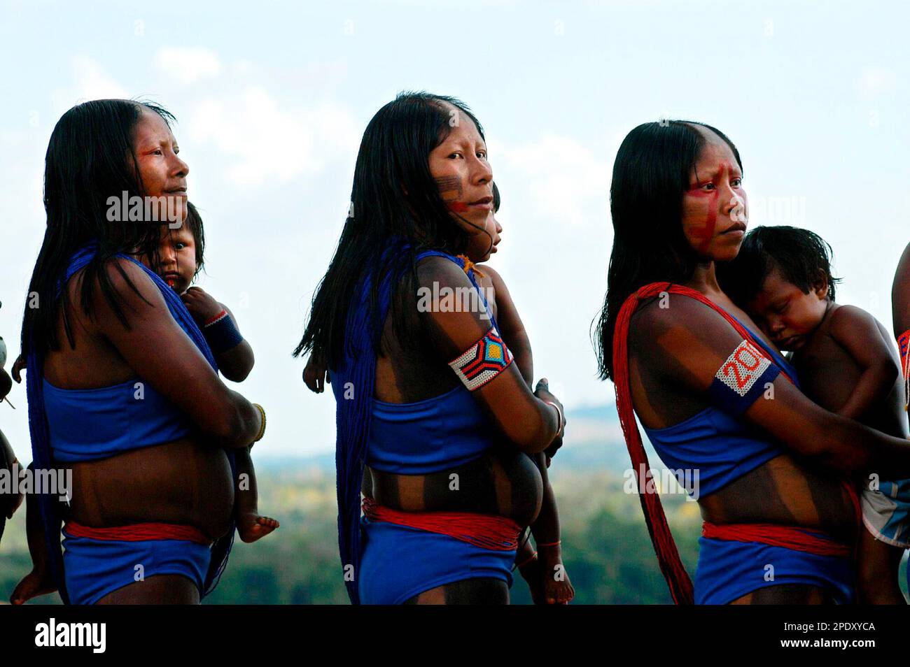 Member of Brazil's Xikrin tribe wait in line to enter at the II ...