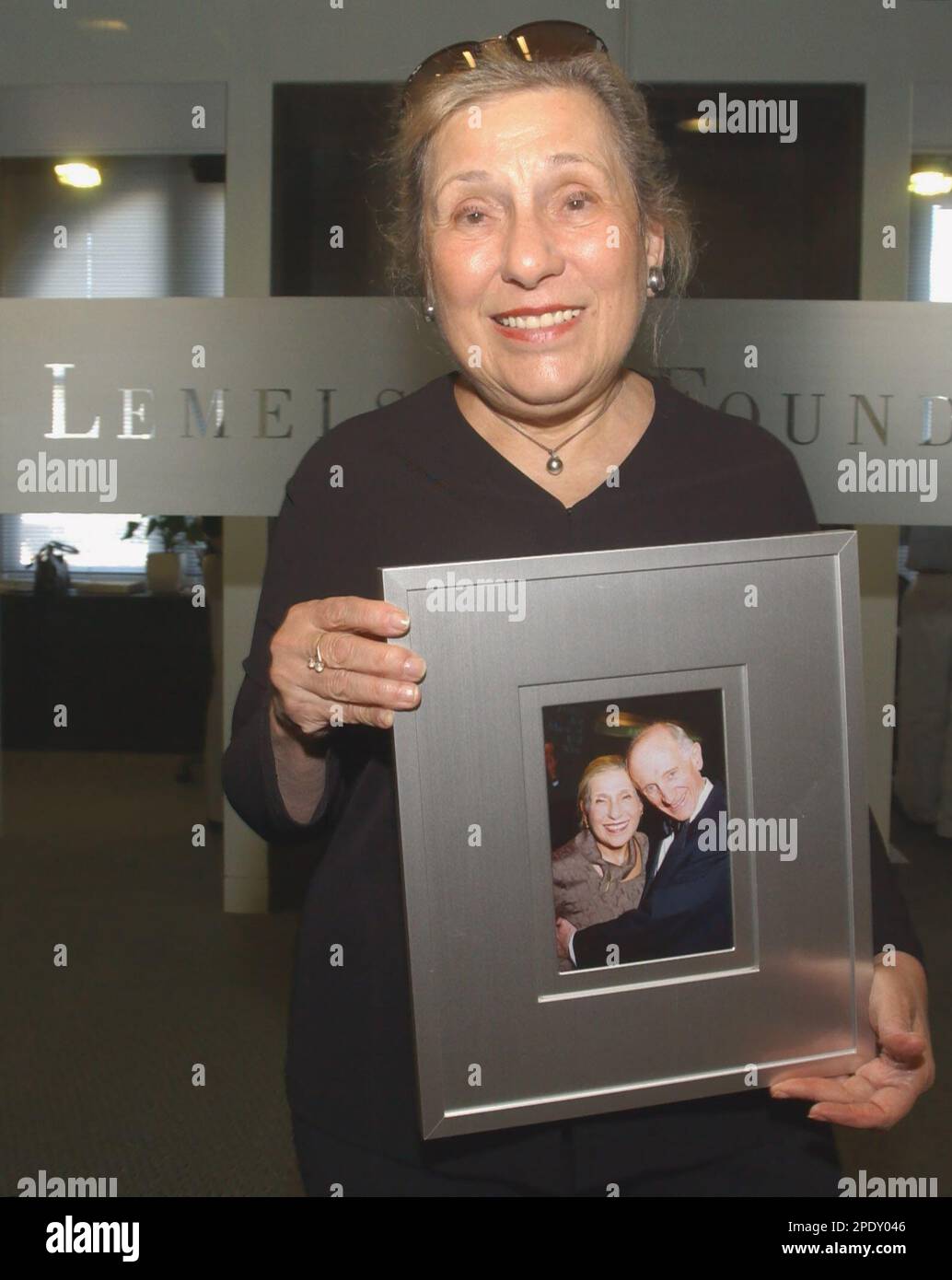 ** ADVANCE FOR SUNDAY, AUG. 21 **Dolly Lemelson holds a photo of her ...