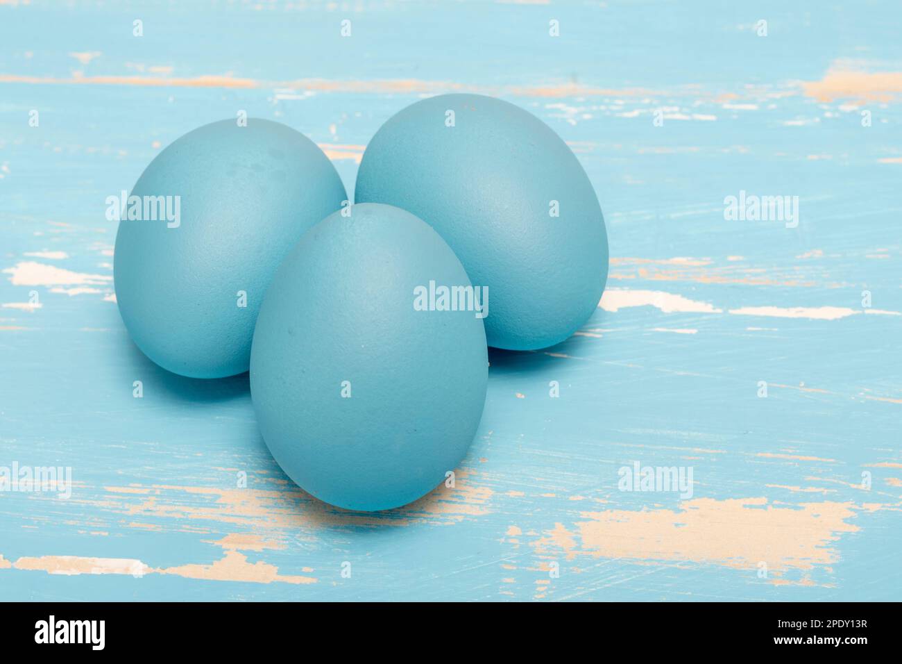 Eggs symbolizing the Easter holiday in blue color on a background of ...