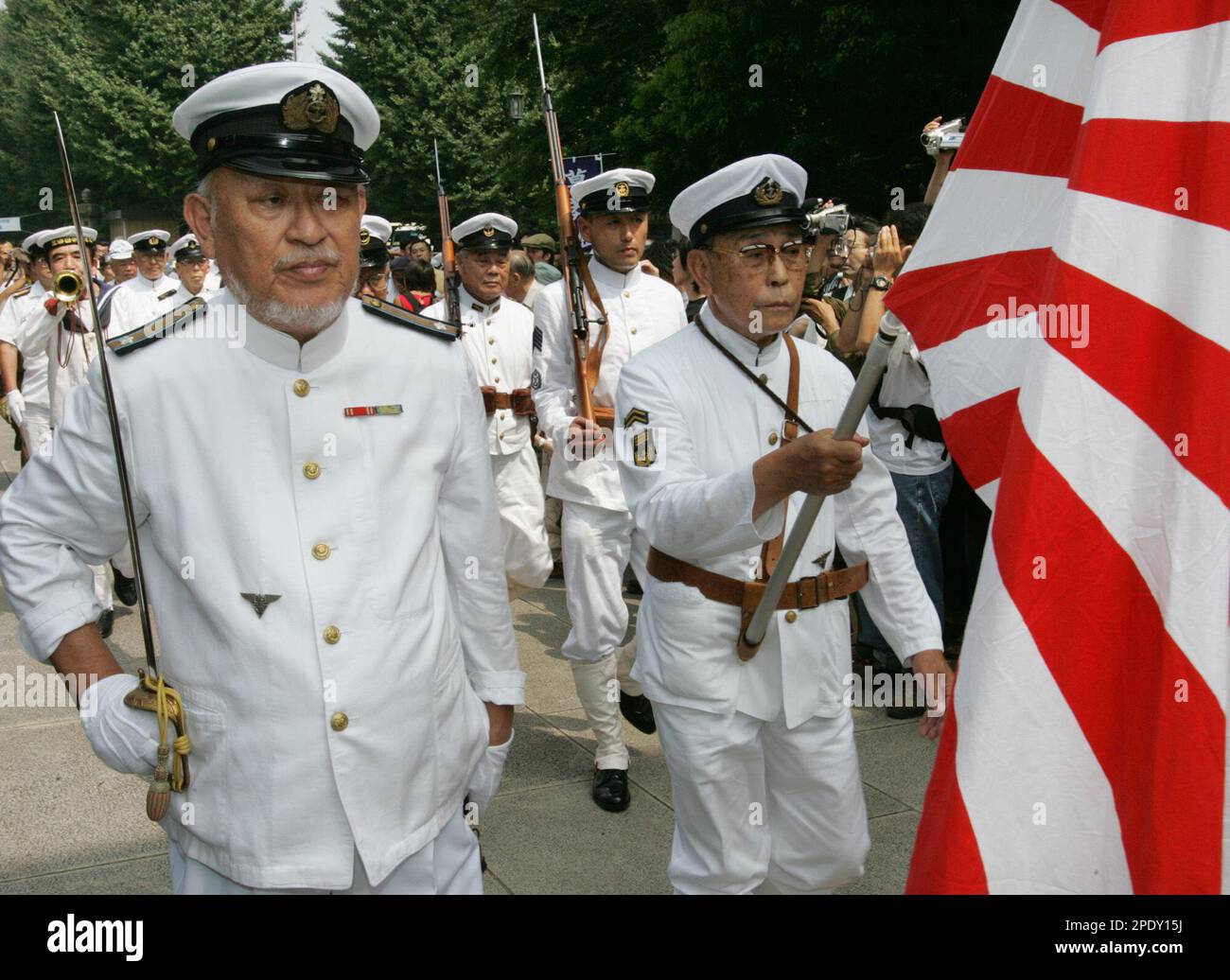 With their rising sun flag, a group of Japanese Imperial Navy veterans ...