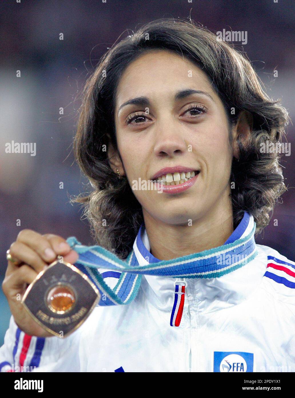 Bouchra Ghezielle of France poses with the bronze medal she won in the ...