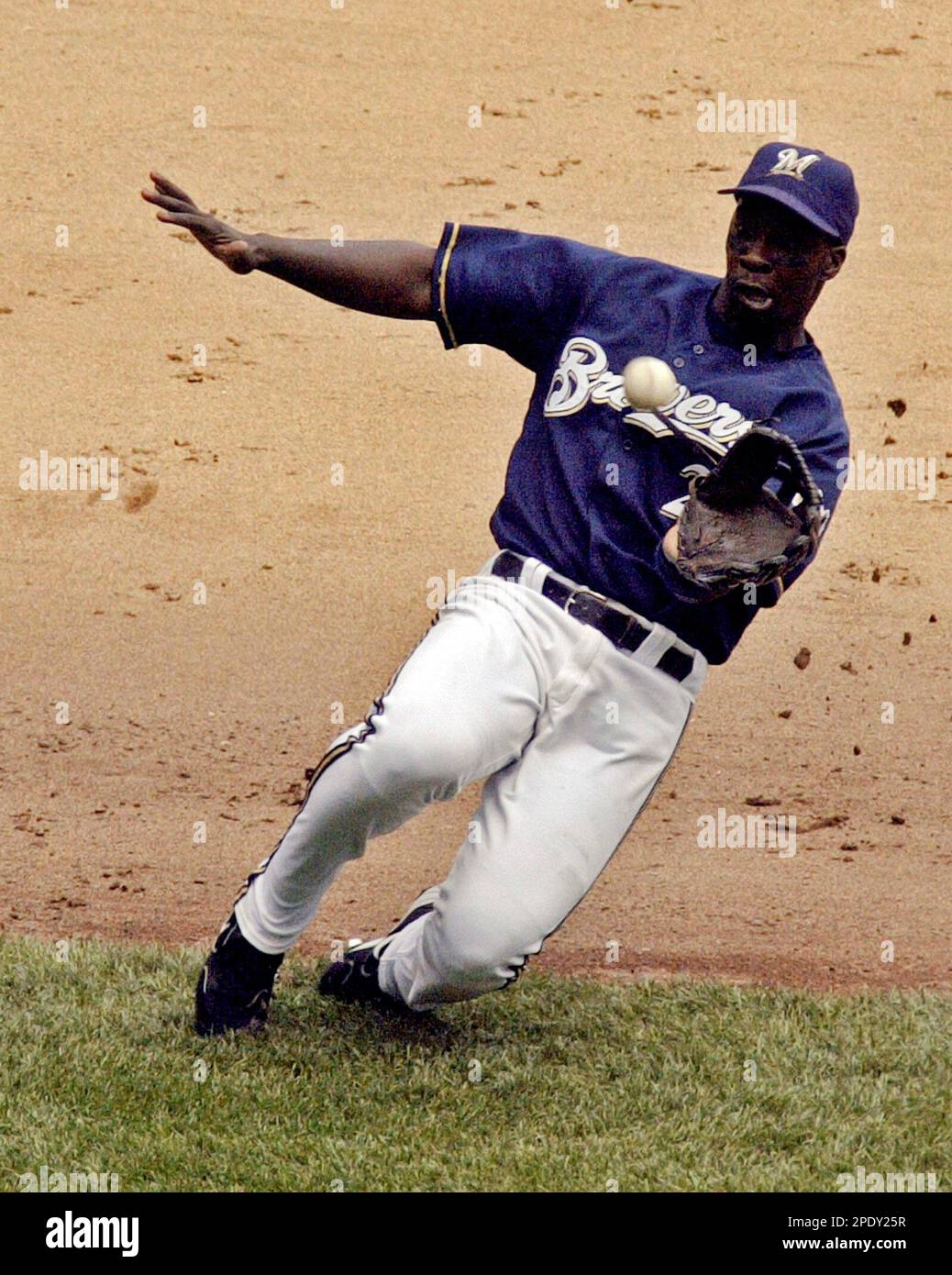 Milwaukee Brewers' Bill Hall makes a sliding catch off of Cincinnati ...