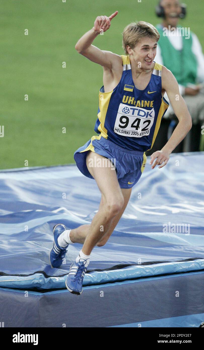 Yuriy Krymarenko of Ukraine celebrates as he makes the winning jump to ...