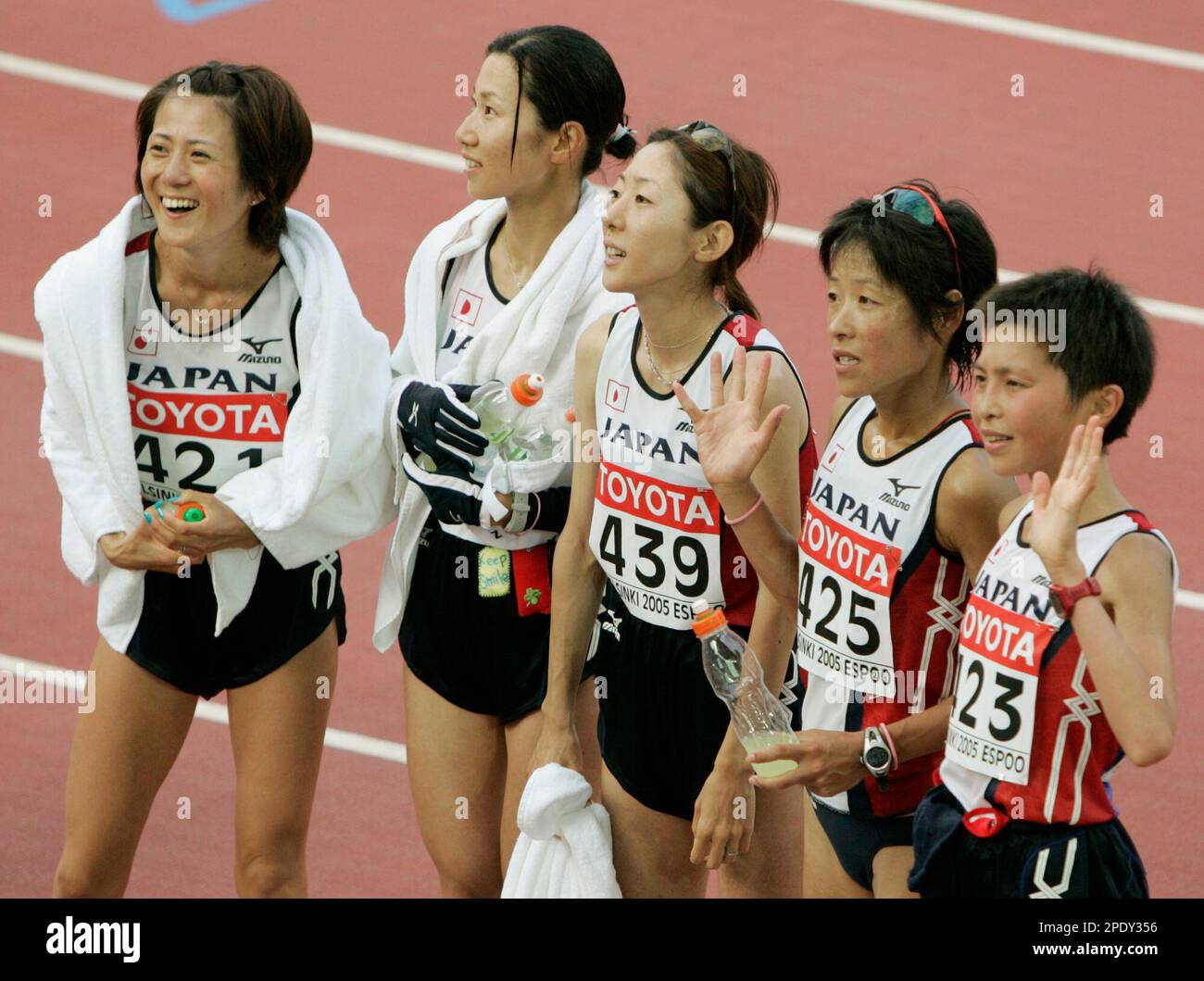Japan's Women's marathon team pose together after finishing in second ...