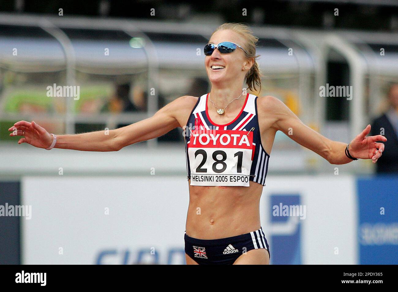 Britain's Paula Radcliffe celebrates as she reaches the line to win the ...