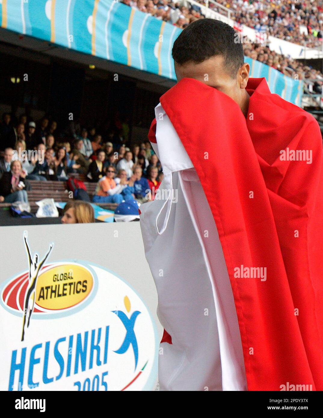 Bahrain's Rashid Ramzi reacts during his victory lap after winning the ...