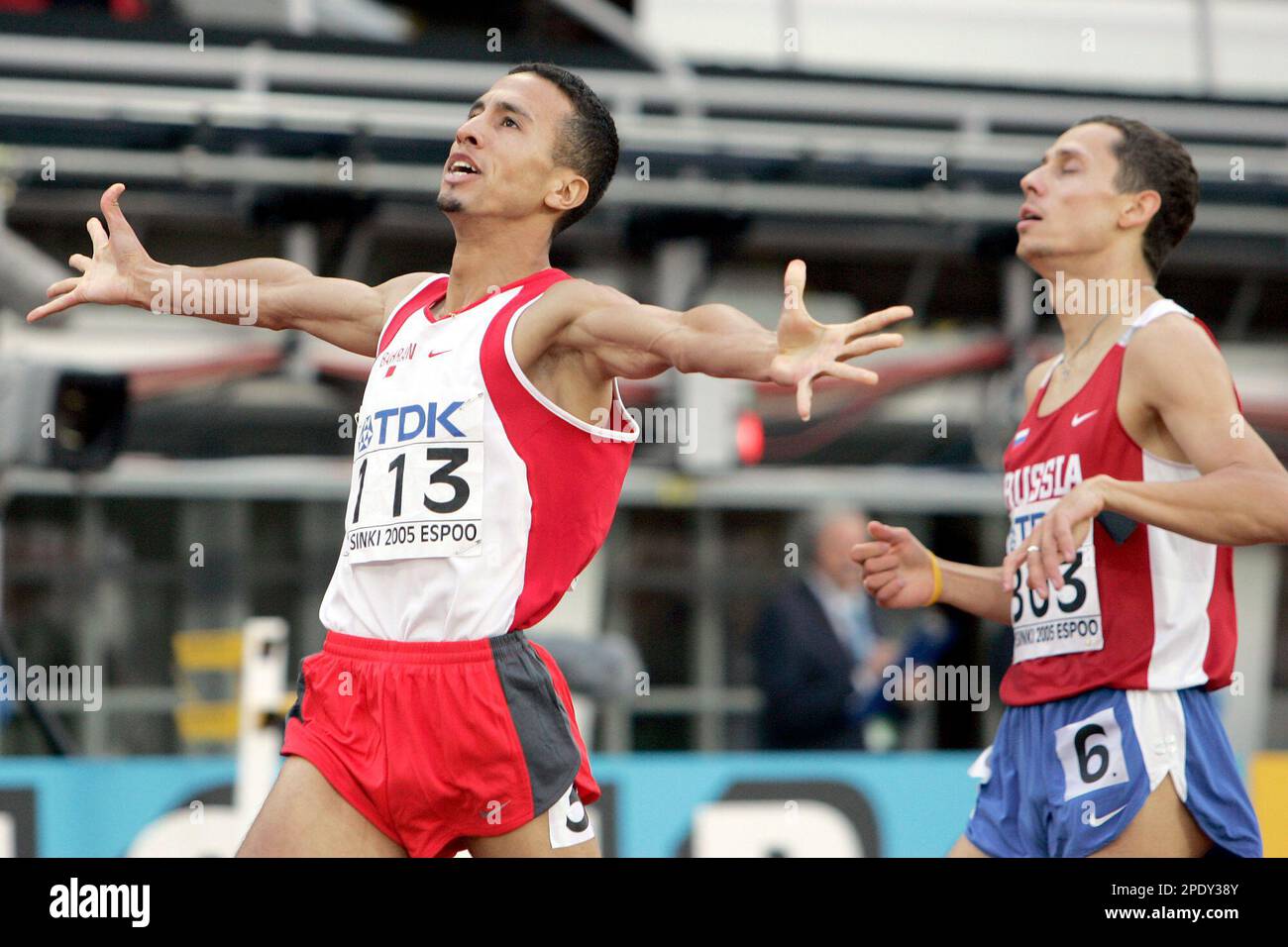 Bahrain's Rashid Ramzi reacts as he crosses the line ahead of Russia's ...