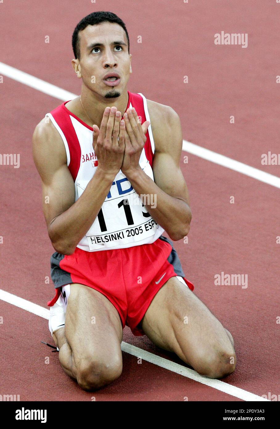 Bahrain's Rashid Ramzi kneels on the track after winning the gold medal ...