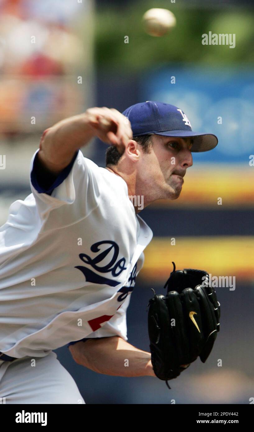 Los Angeles Dodgers pitcher D.J. Houlton pitches to the New York Mets ...
