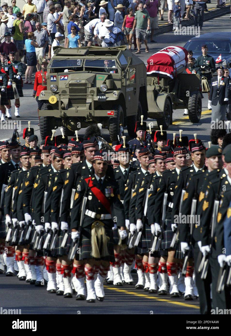 The flag draped coffin of war hero Ernest "Smokey" Smith is carried ...