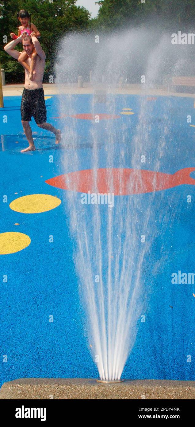 E.J. Snetsky, of Needham, Mass, carries his niece Brianna Williamson, 5 ...