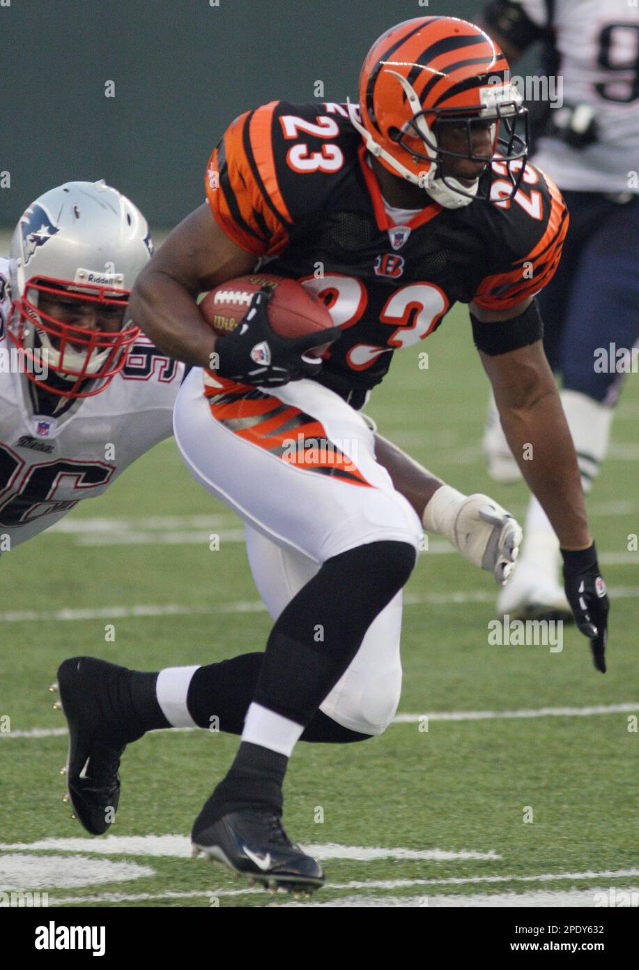 Cincinnati Bengals running back Chris Perry (23) runs past New England ...