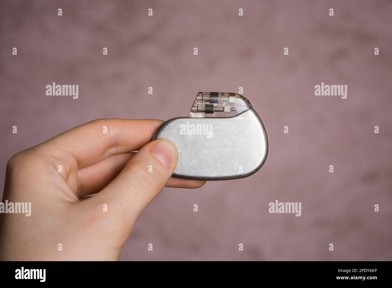 medical pacemaker hold in hand Stock Photo - Alamy