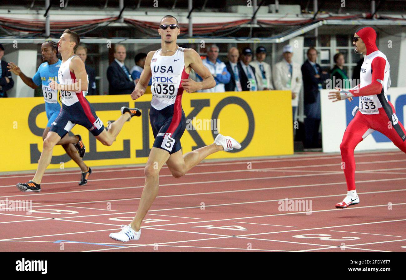 Jeremy Wariner of the USA, center, crosses the finish line to win the ...