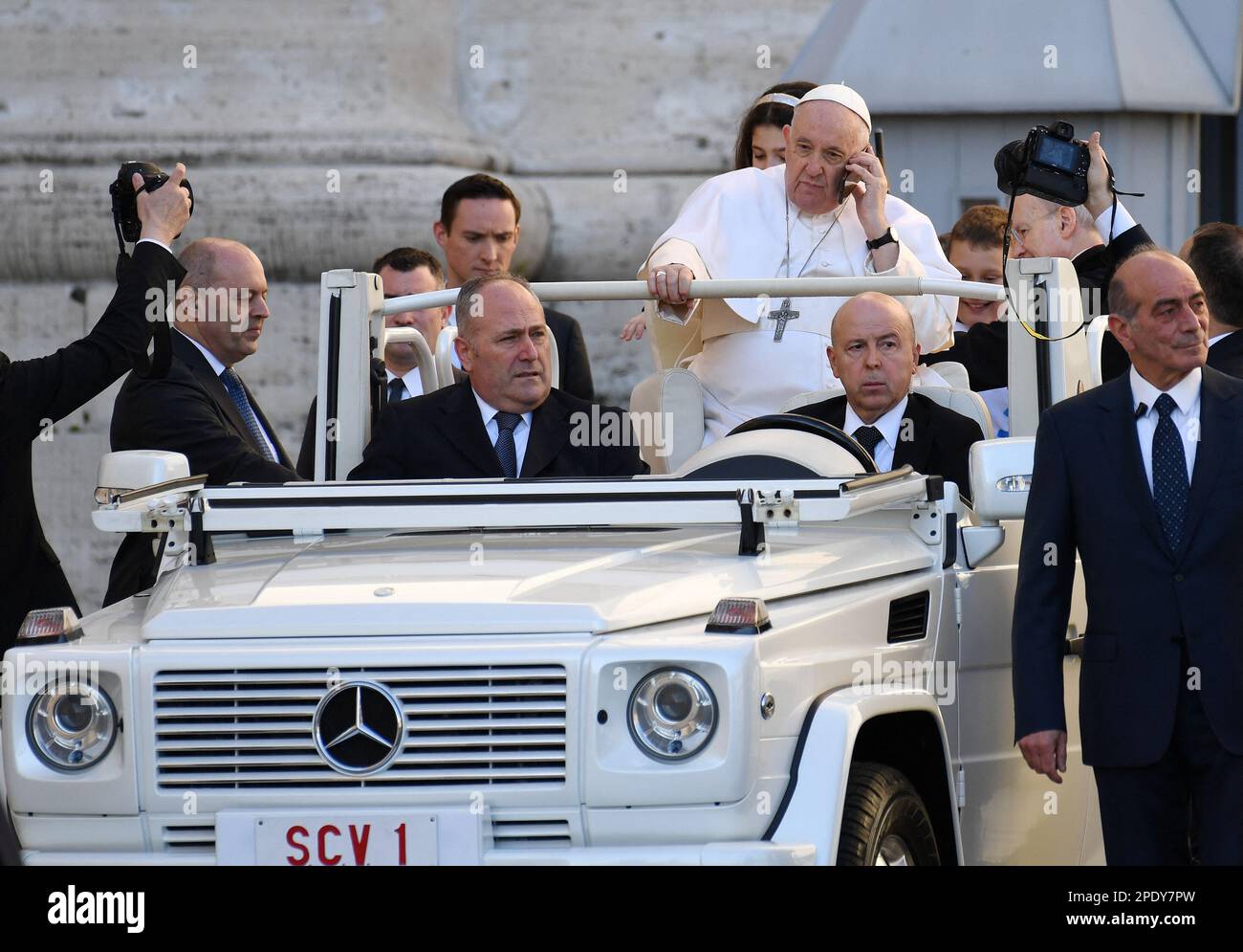 Vatican, March 15, 2023. Pope Francis talks on the phone as he arrives ...