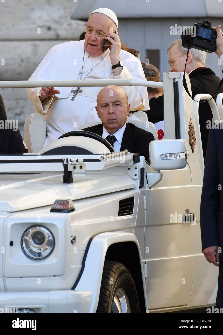 Vatican, March 15, 2023. Pope Francis talks on the phone as he arrives ...