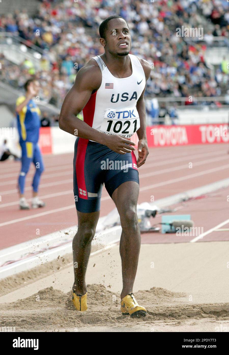 Dwight Phillips of the United States walks from the pit after jumping ...