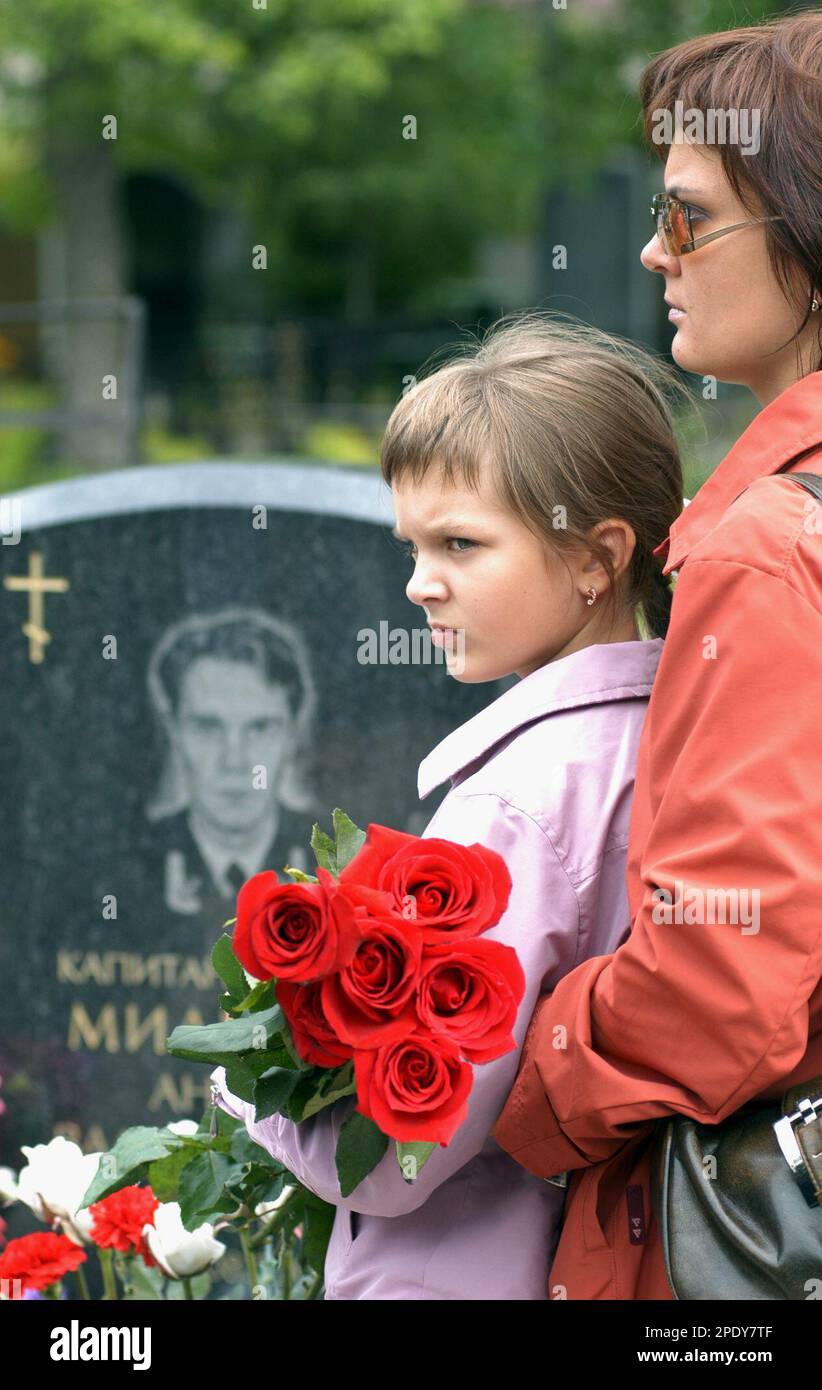 The widow, no name given, and daughter, Lera, of Capt. Andrei Milyutin ...