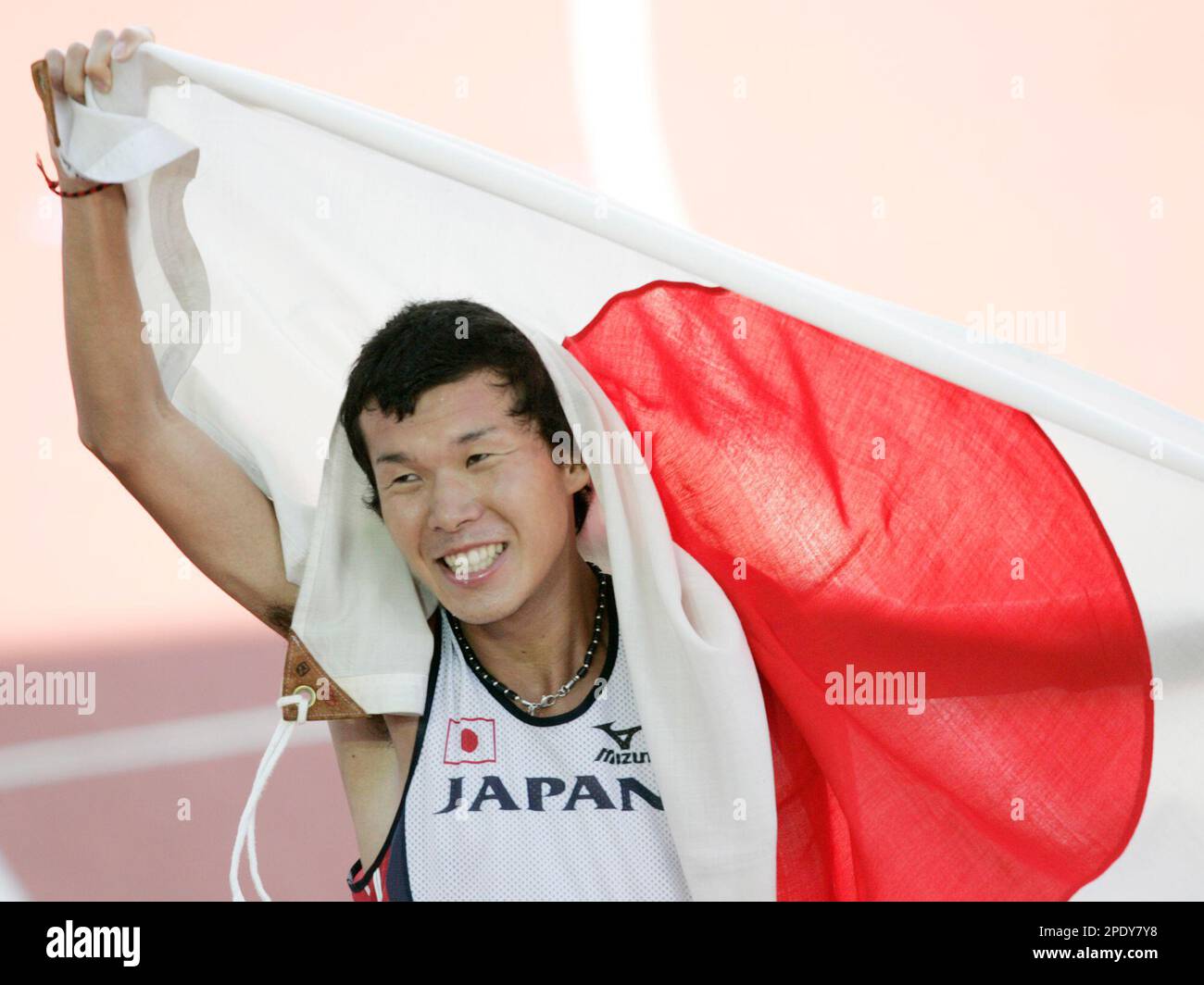 Japan's Yuki Yamazaki holds the Japanese flag after finishing eighth in ...