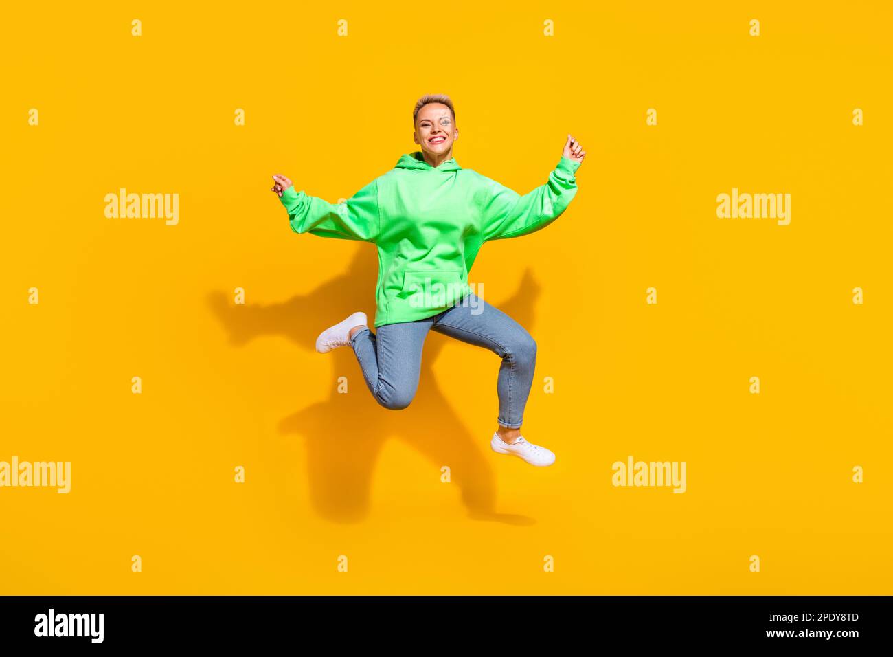 Full length portrait of pretty overjoyed person toothy smile jumping ...
