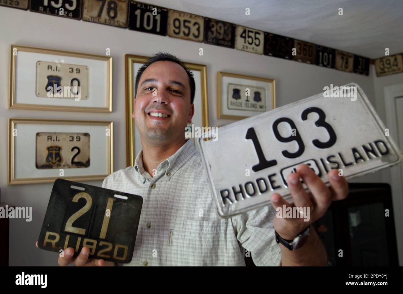 License plate collector John Raiche, 40, of Coventry, R.I., displays ...