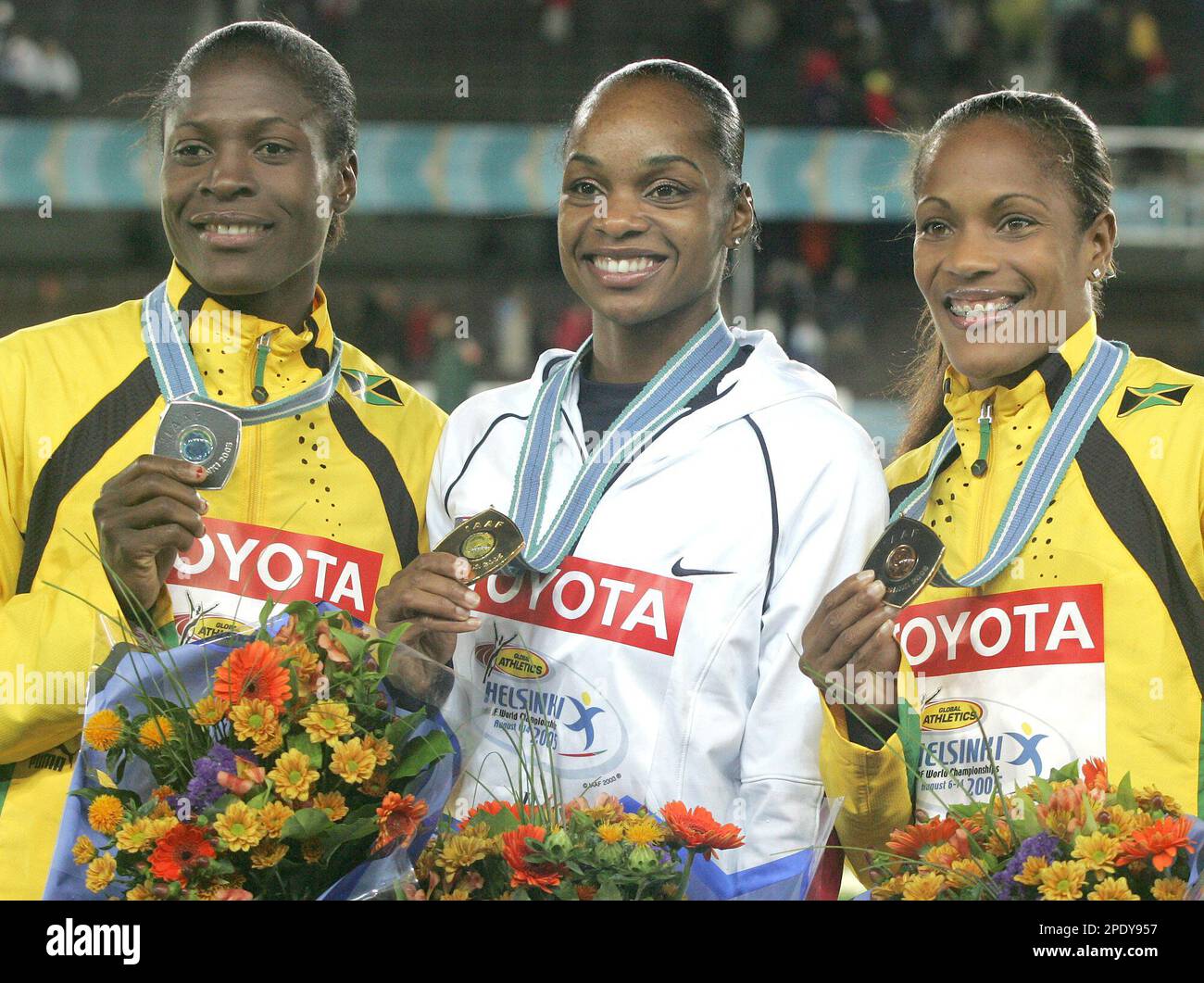 Michelle Perry of the United States, gold, is flanked at left by ...