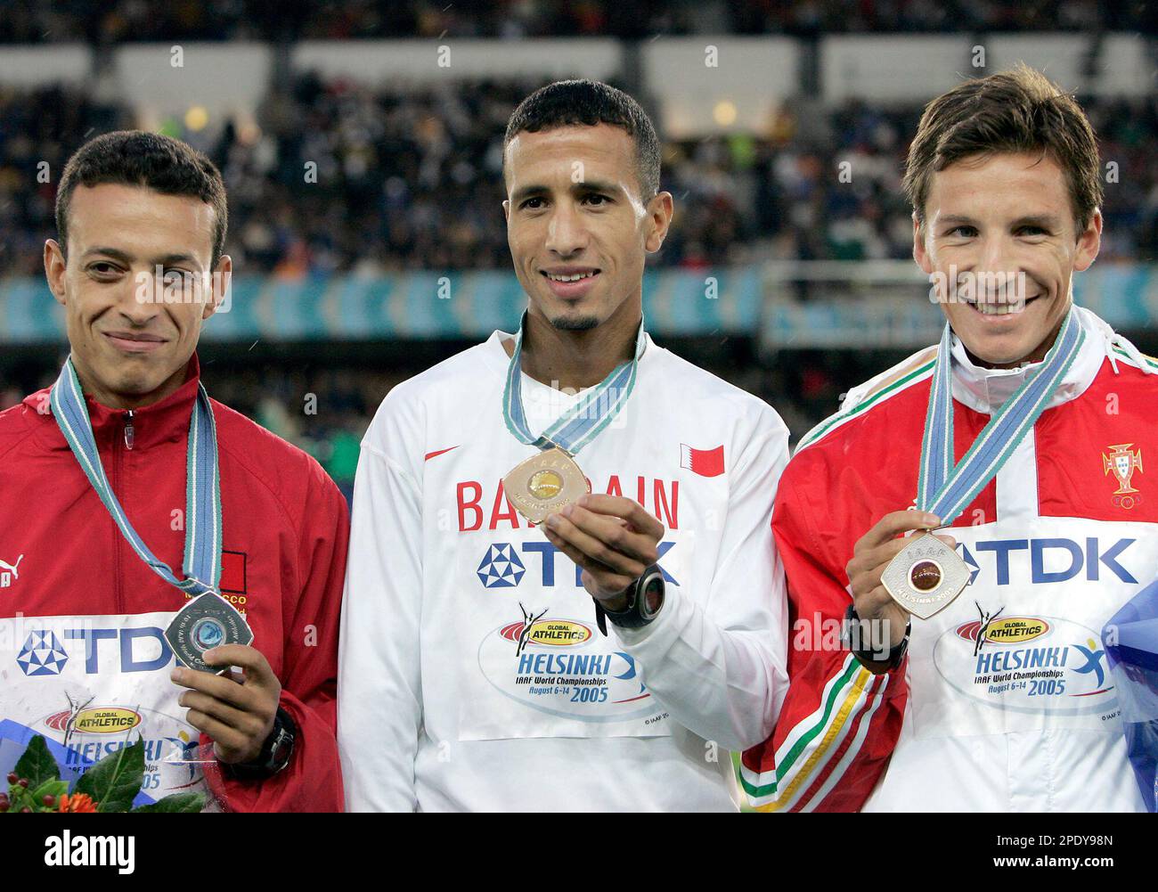 Gold medalist Rashid Ramzi of Bahrain, center, poses with silver ...