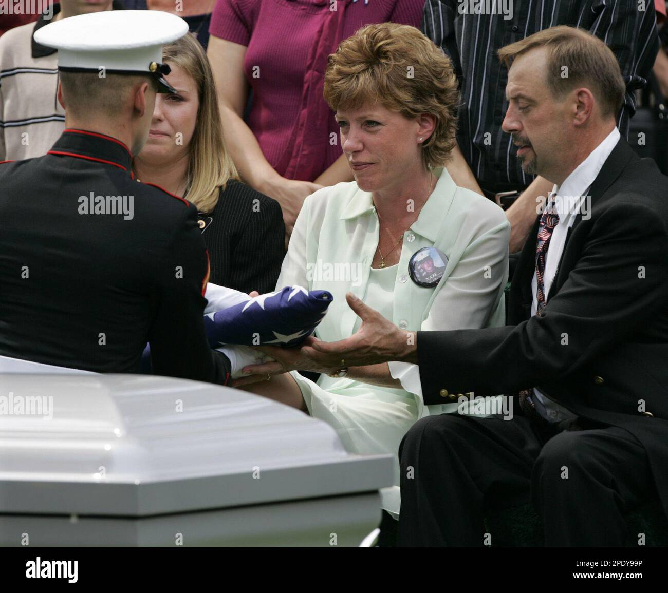 The family of Marine Lance Cpl. Daniel Deyarmin, Jr., from left, his ...